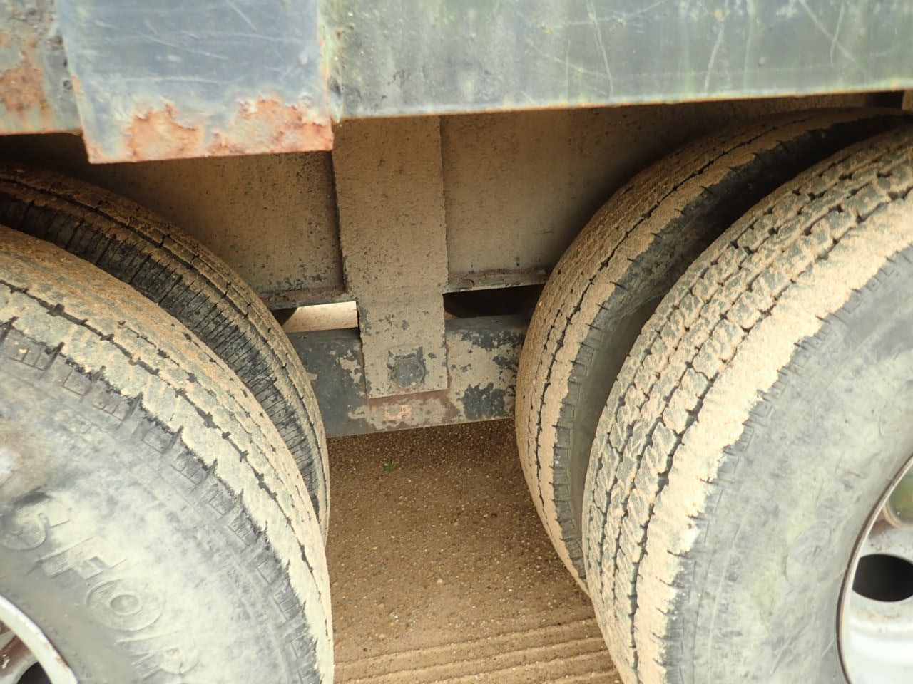 1996 MACK DM690S Grapple Truck - J.M. Wood Auction Company, Inc.