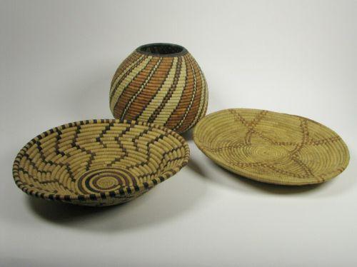 THREE WEST AFRICAN BASKETS, of woven polychro