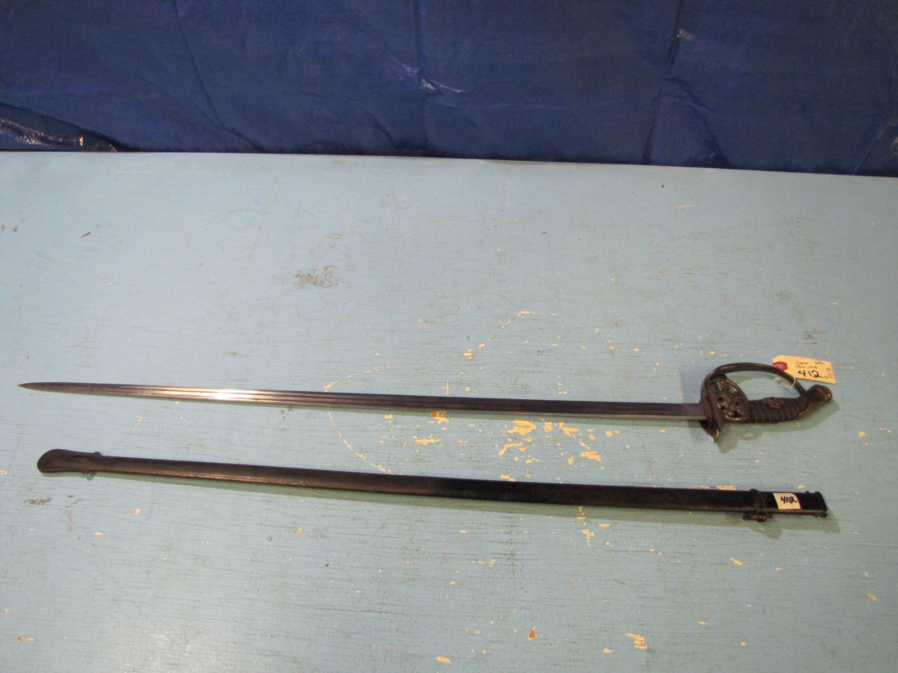 Imperial German infantry officers sword and scabbard. Emblem Kaiser WM2 ...