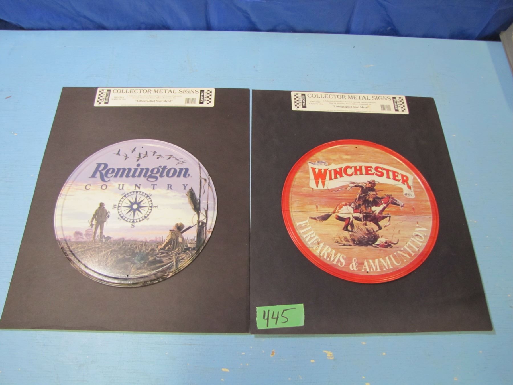 Remington and Winchester collector metal signs