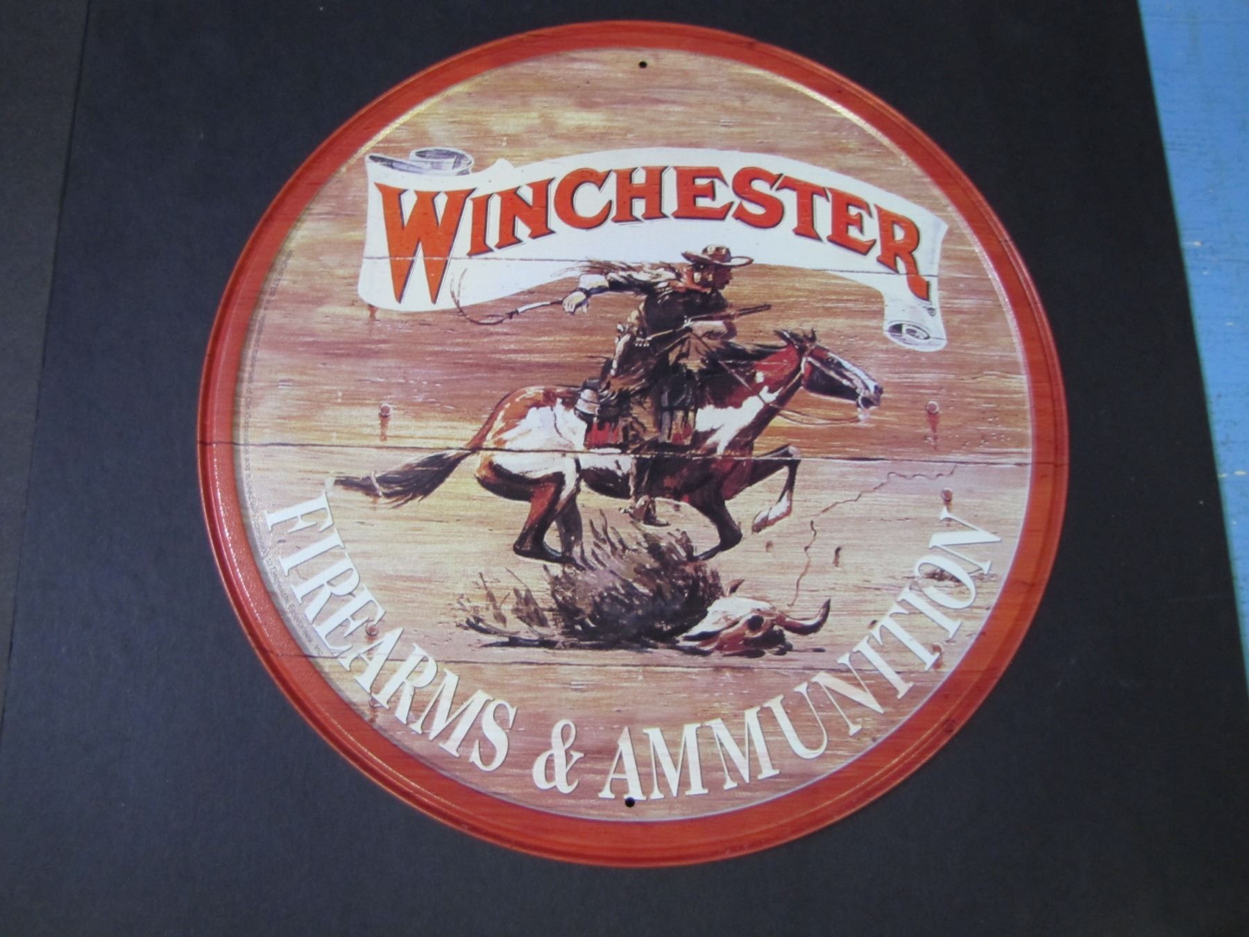 Remington and Winchester collector metal signs