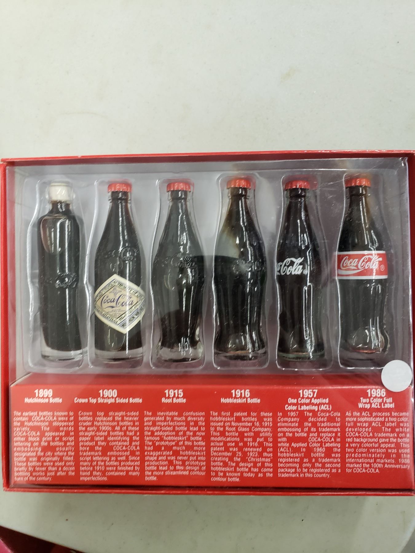 SIX MINI SAMPLES OF COCA COLA FROM 1899,1900,1915, 1916, 1957, 1986