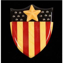 Bakelite Laminated Red, White & Blue Shield Pin.