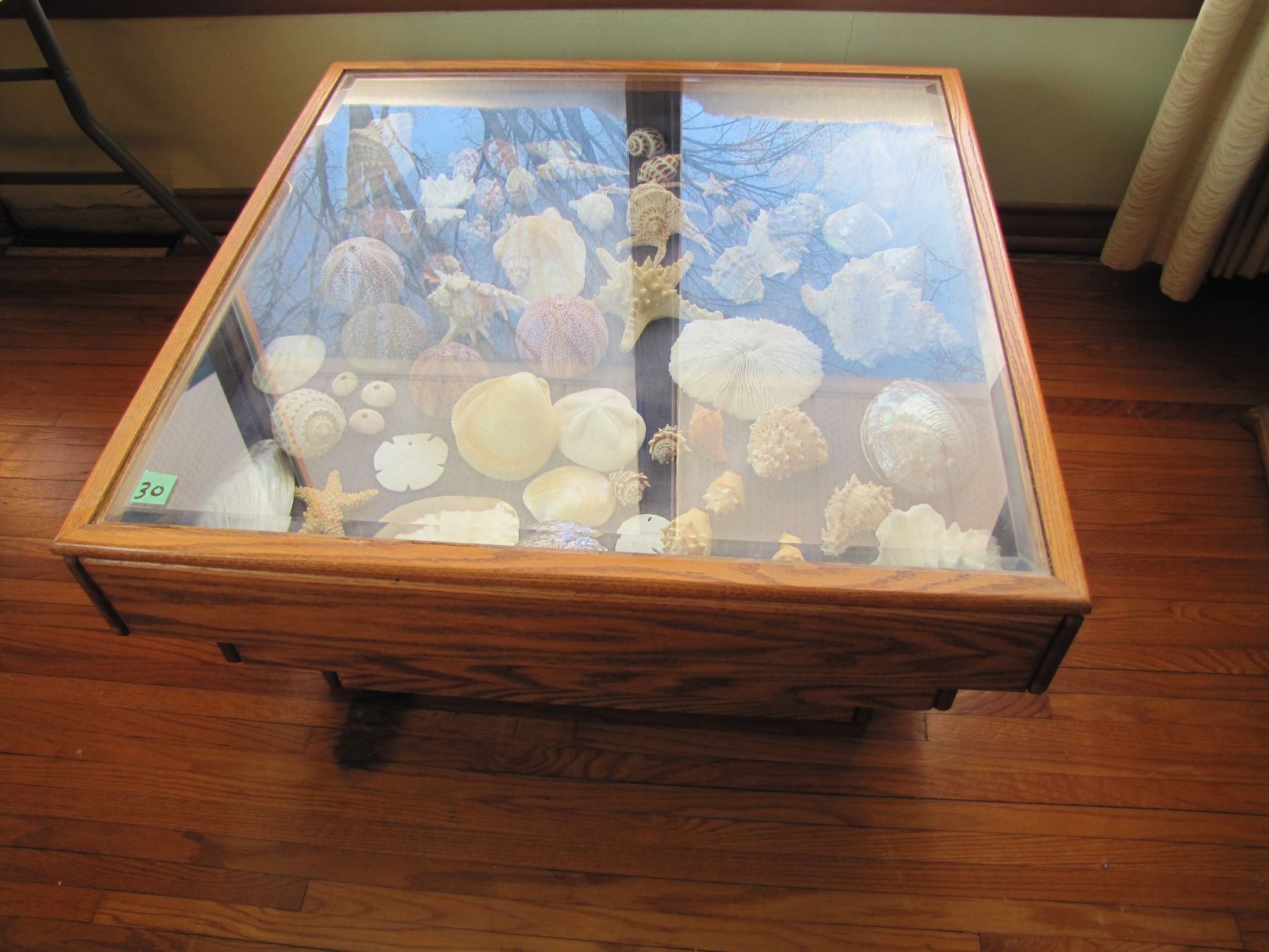 wood and beveled glass display coffee table. approximately 36 by 36 in ...