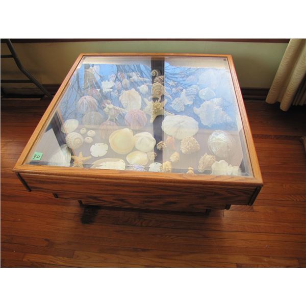 wood and beveled glass display coffee table. approximately 36 by 36 in ...