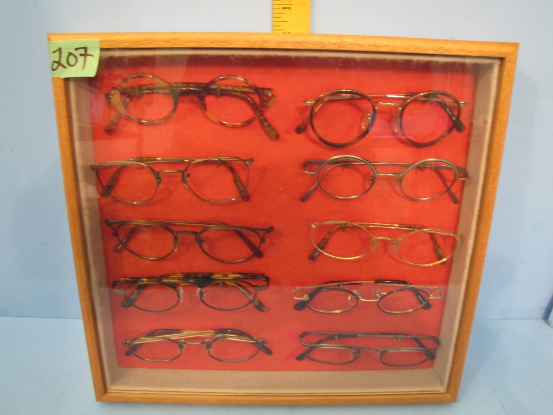 shadow box with eyeglass collection, wall hanging