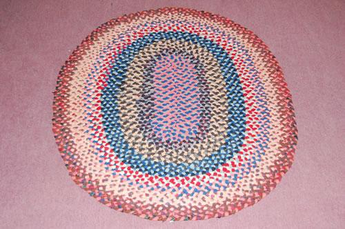 EARLY 20TH CENT. VINTAGE HAND BRAIDED RUG