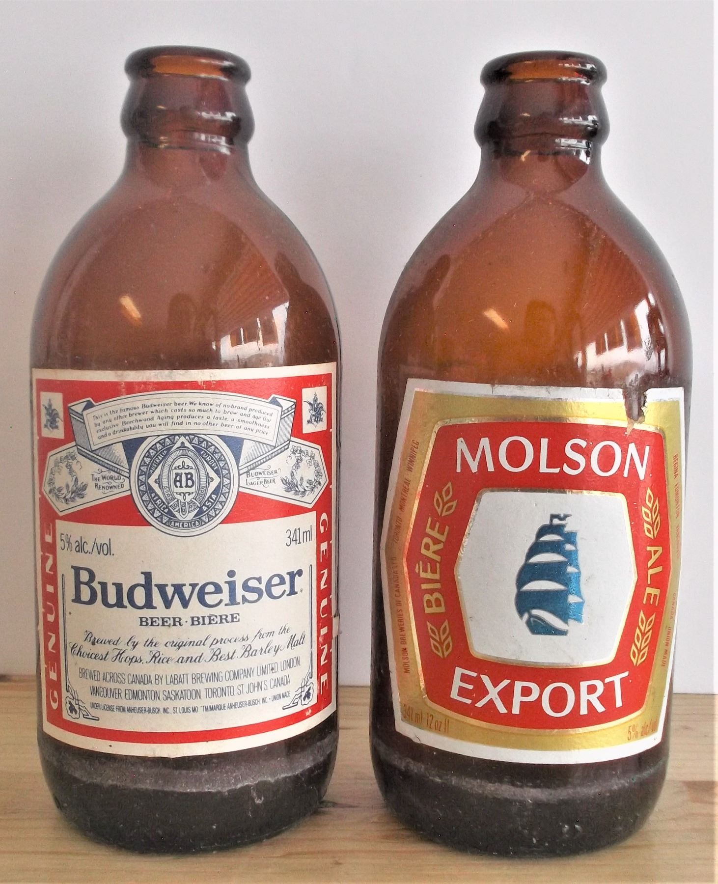 Two Stubby Beer Bottles - Budweiser and Molson Export