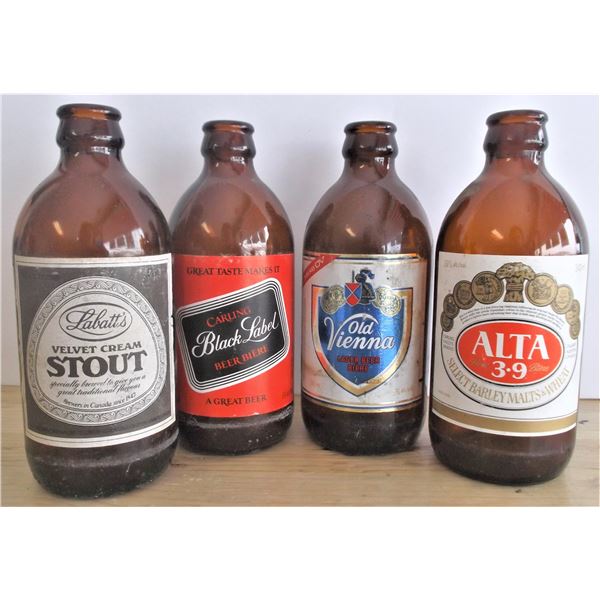 Four Stubby Beer Bottles