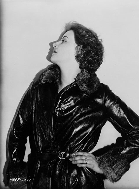 Photographer: Russell Ball - Greta Garbo in leather coat (1925).
