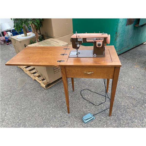 Atlas sewing machine in cabinet
