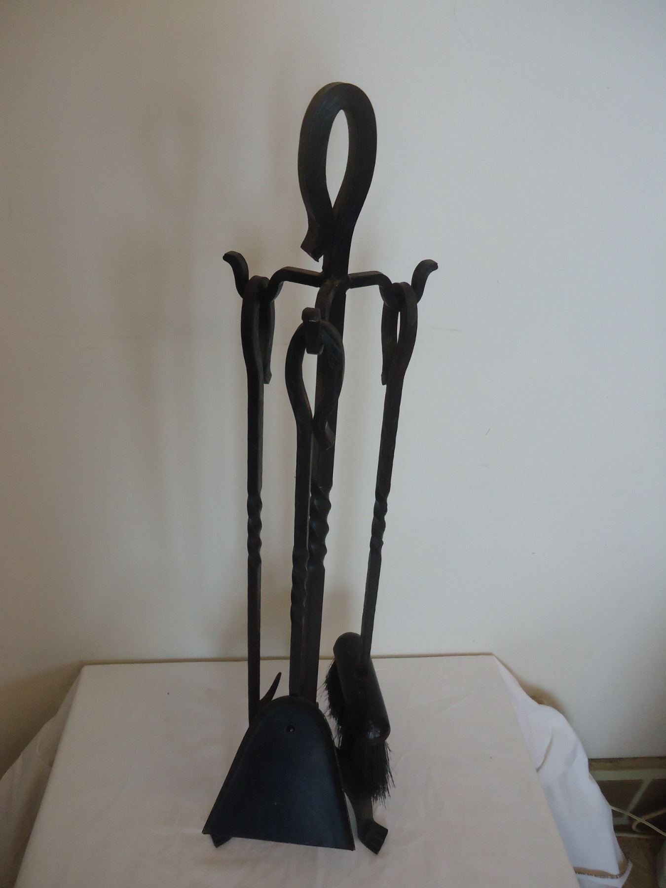 Three piece wrought iron fireplace set with stand