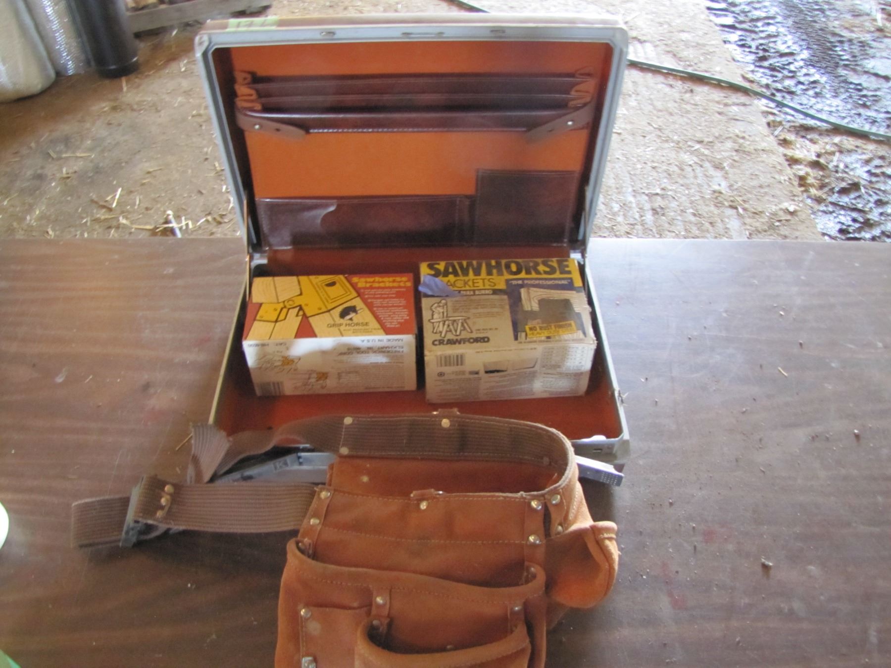 Briefcase with sawhorse brackets and carpenters belt