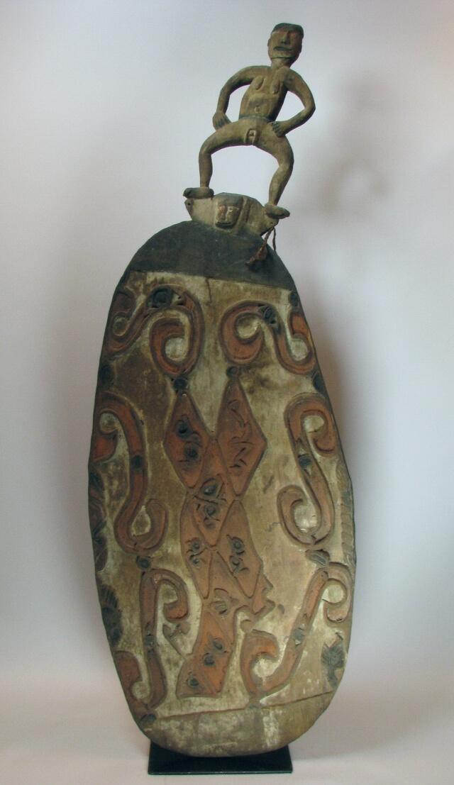 AN EARLY ASMAT SHIELD, c.1960s, of wood in asymmetrical ovoid form sculpted