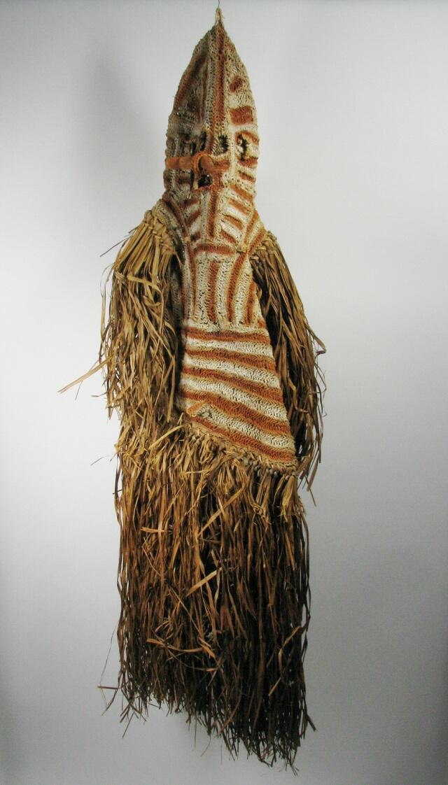 A FINE ASMAT DANCE COSTUME (jipaee), of woven fibre with grass tassels ador