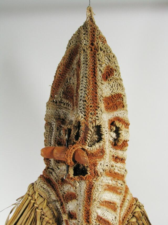 A FINE ASMAT DANCE COSTUME (jipaee), of woven fibre with grass tassels ador