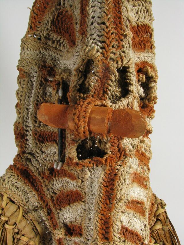 A FINE ASMAT DANCE COSTUME (jipaee), of woven fibre with grass tassels ador