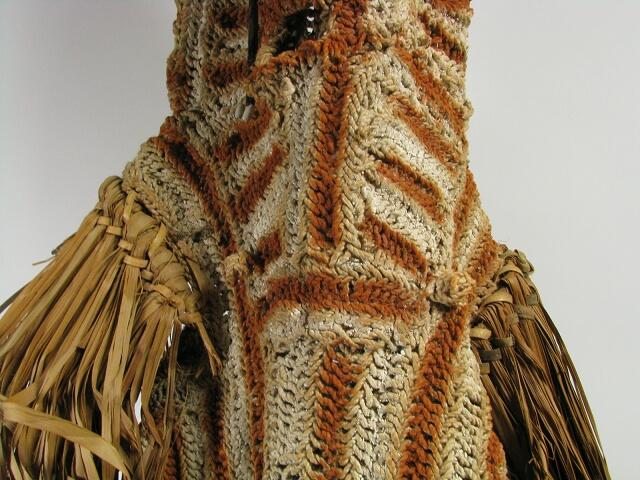 A FINE ASMAT DANCE COSTUME (jipaee), of woven fibre with grass tassels ador
