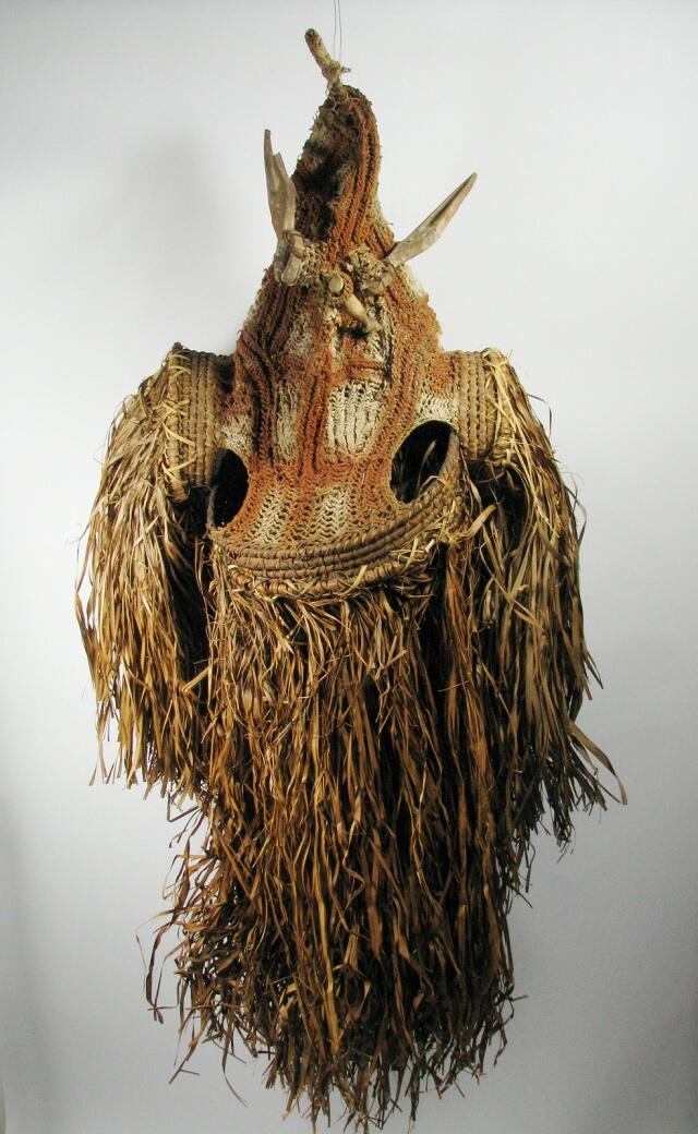 A FINE ASMAT DANCE COSTUME (jipaee), of woven cane and fibre with grass tas