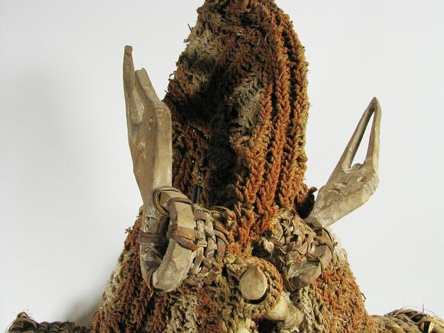 A FINE ASMAT DANCE COSTUME (jipaee), of woven cane and fibre with grass tas