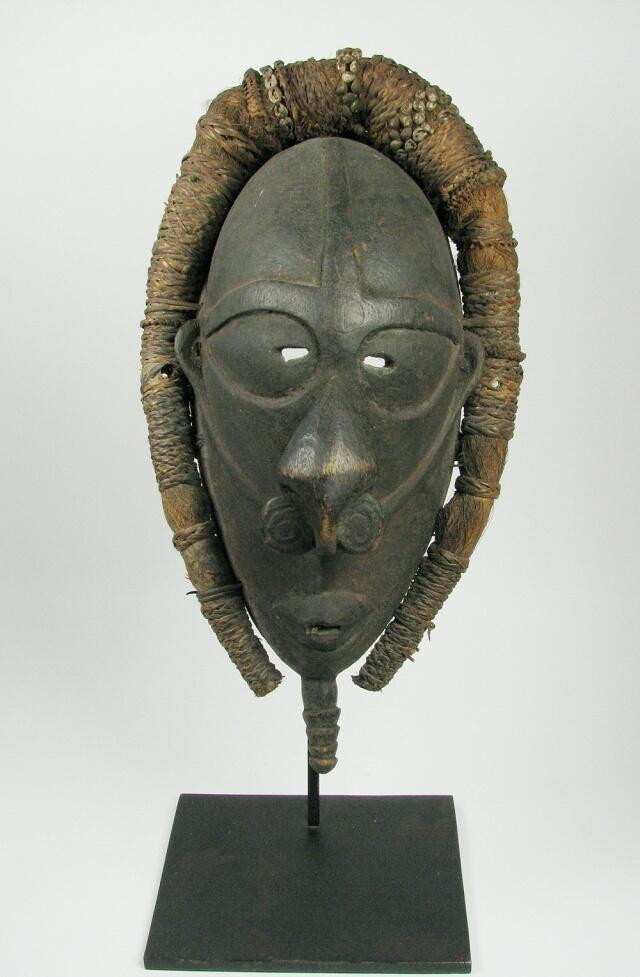 A FINE LEWA CEREMONIAL MASK, in classic ancestor form, the outer rim pierce