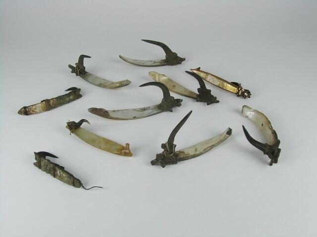 A COLLECTION OF TEN SOLOMON ISLANDS FISH HOOKS, the classic fibre bound she