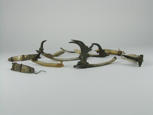 A COLLECTION OF TEN SOLOMON ISLANDS FISH HOOKS, the classic fibre bound she