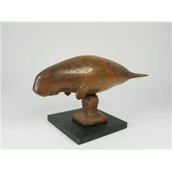A RARE TORRES STRAIT SCULPTURE, c.1950s, of wood in the form of a dugong, s