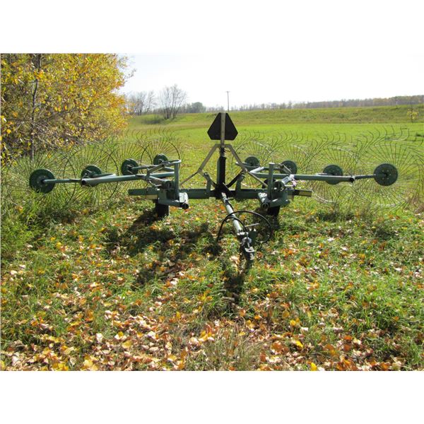 John Deere V rake; works real good; used with 12 foot mower;