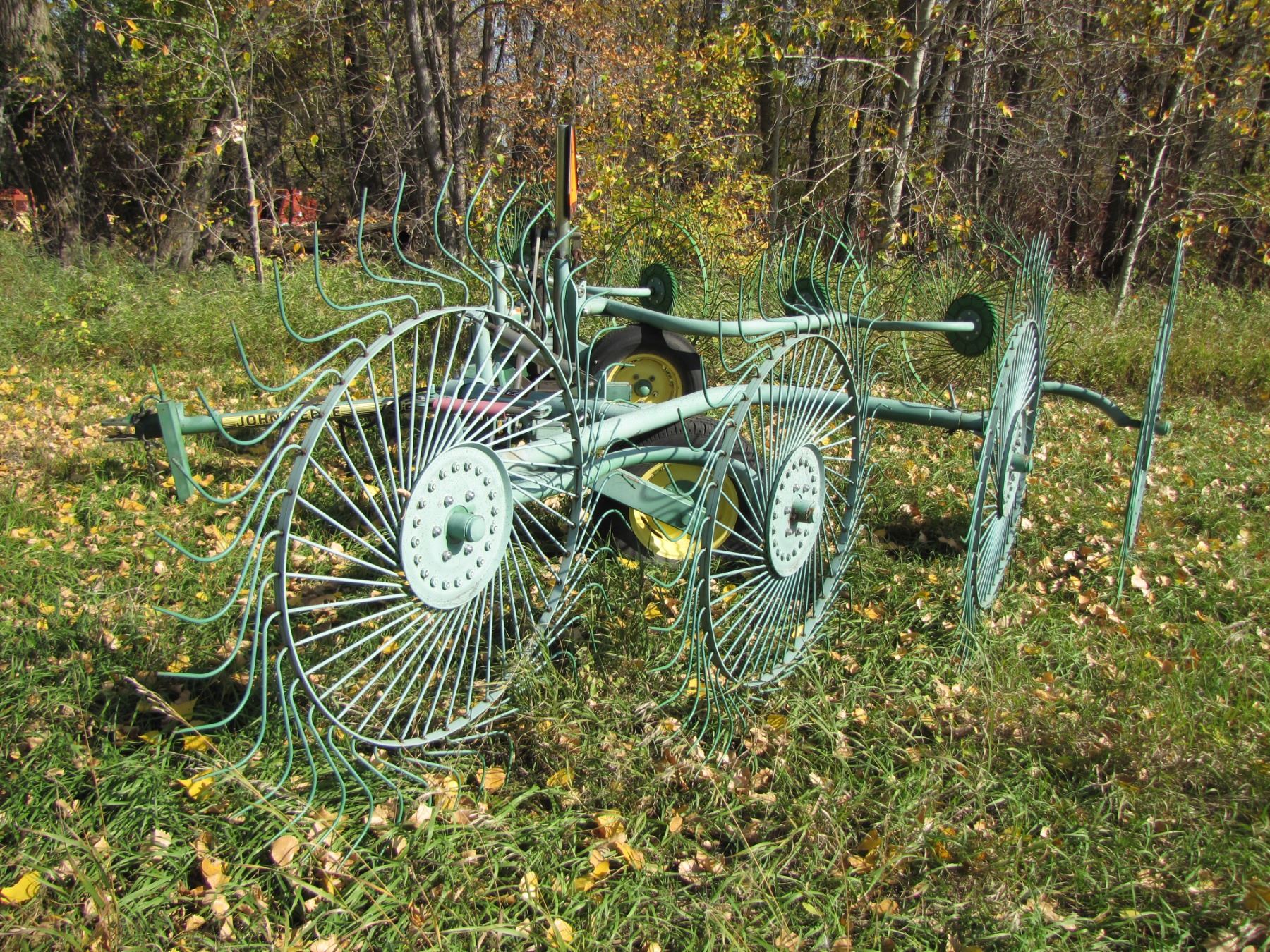 John Deere V rake; works real good; used with 12 foot mower;