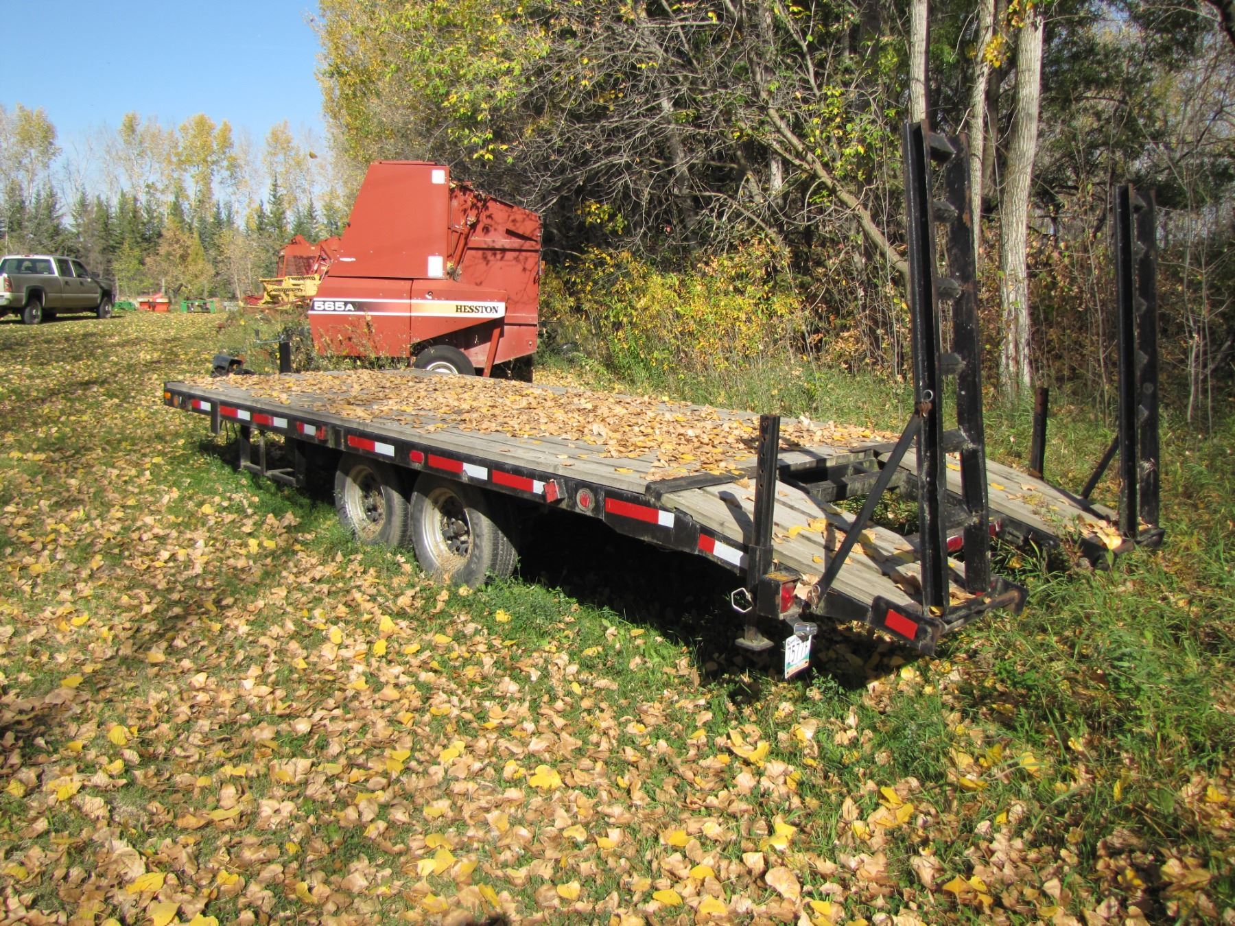 Tandem axle 16 foot flatbed trailer with beavertails ; new tires