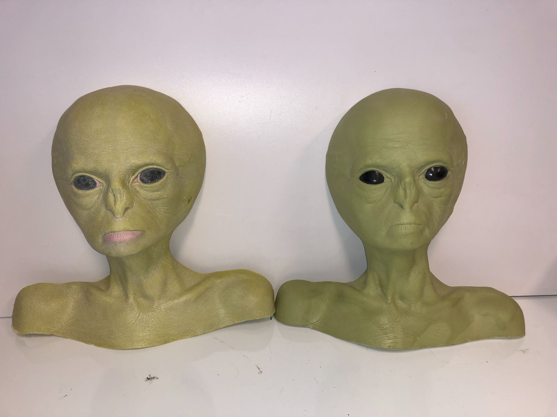 Group of 2 Alien head props from the special effects studio