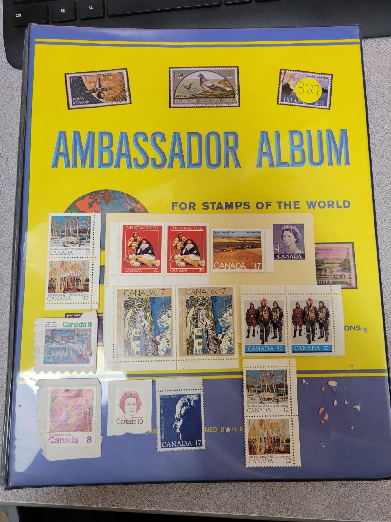Ambassador album for stamps of the world and some stamps