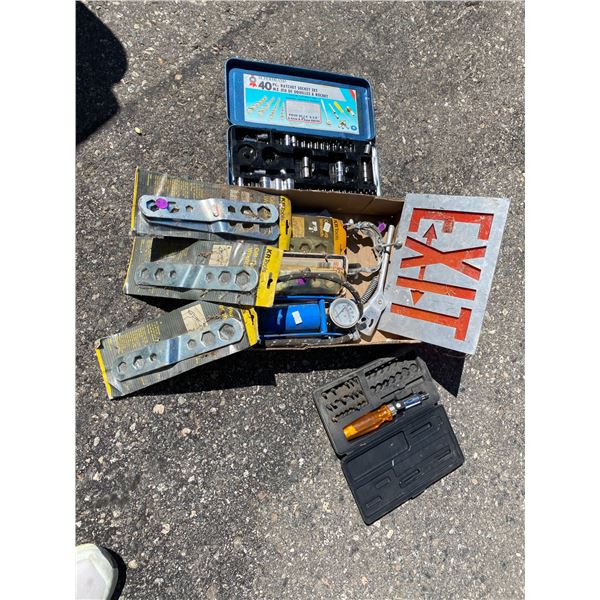 Assorted tools and exit sign