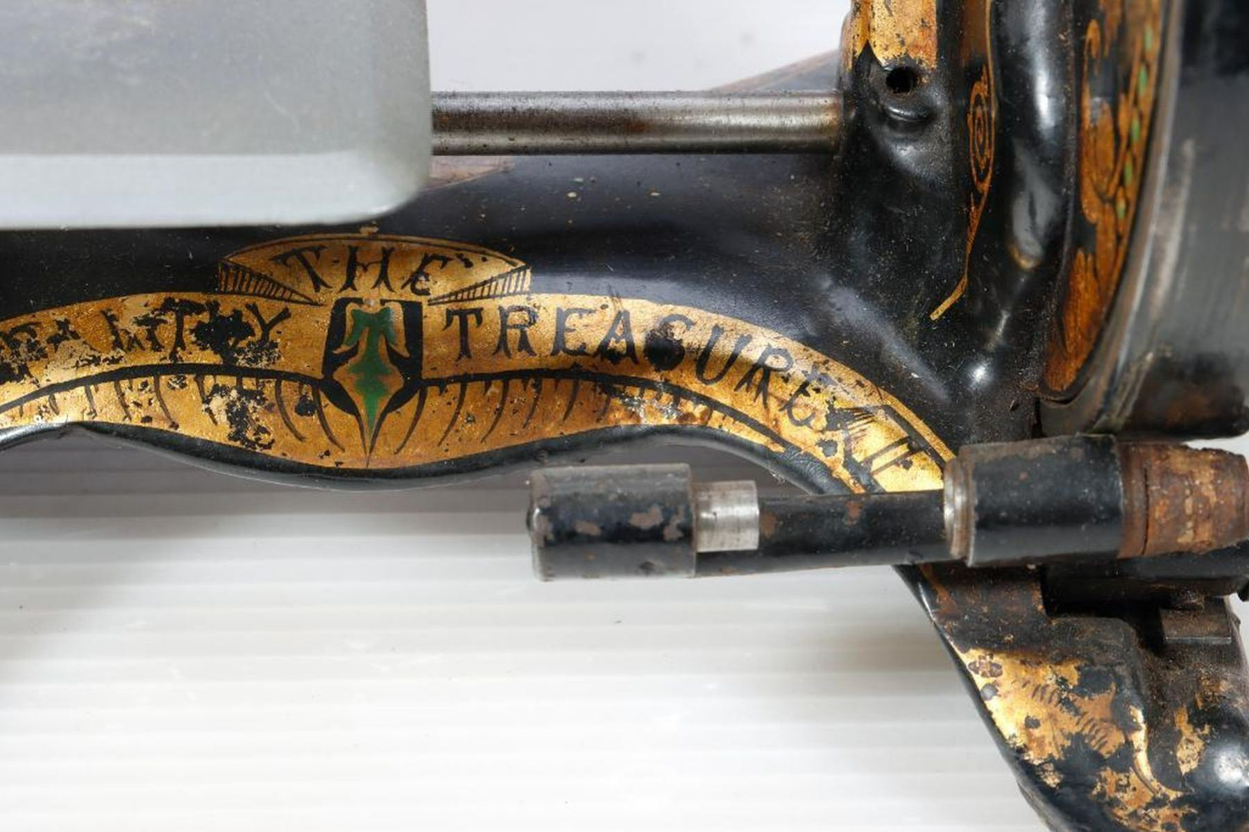 Antique manual sewing machine. Lion HR trademark. Lion is carrying flag ...