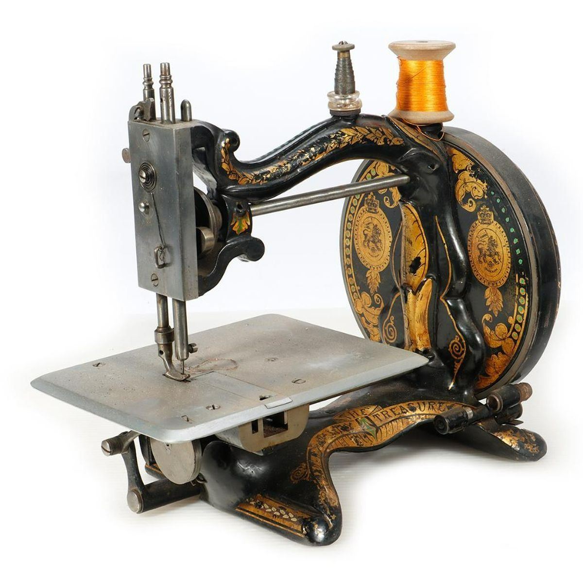 Antique manual sewing machine. Lion HR trademark. Lion is carrying flag ...