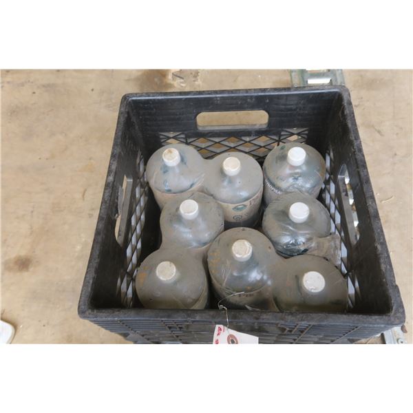 Black crate of 8 of the 16.4 oz mini propane tanks, unused.