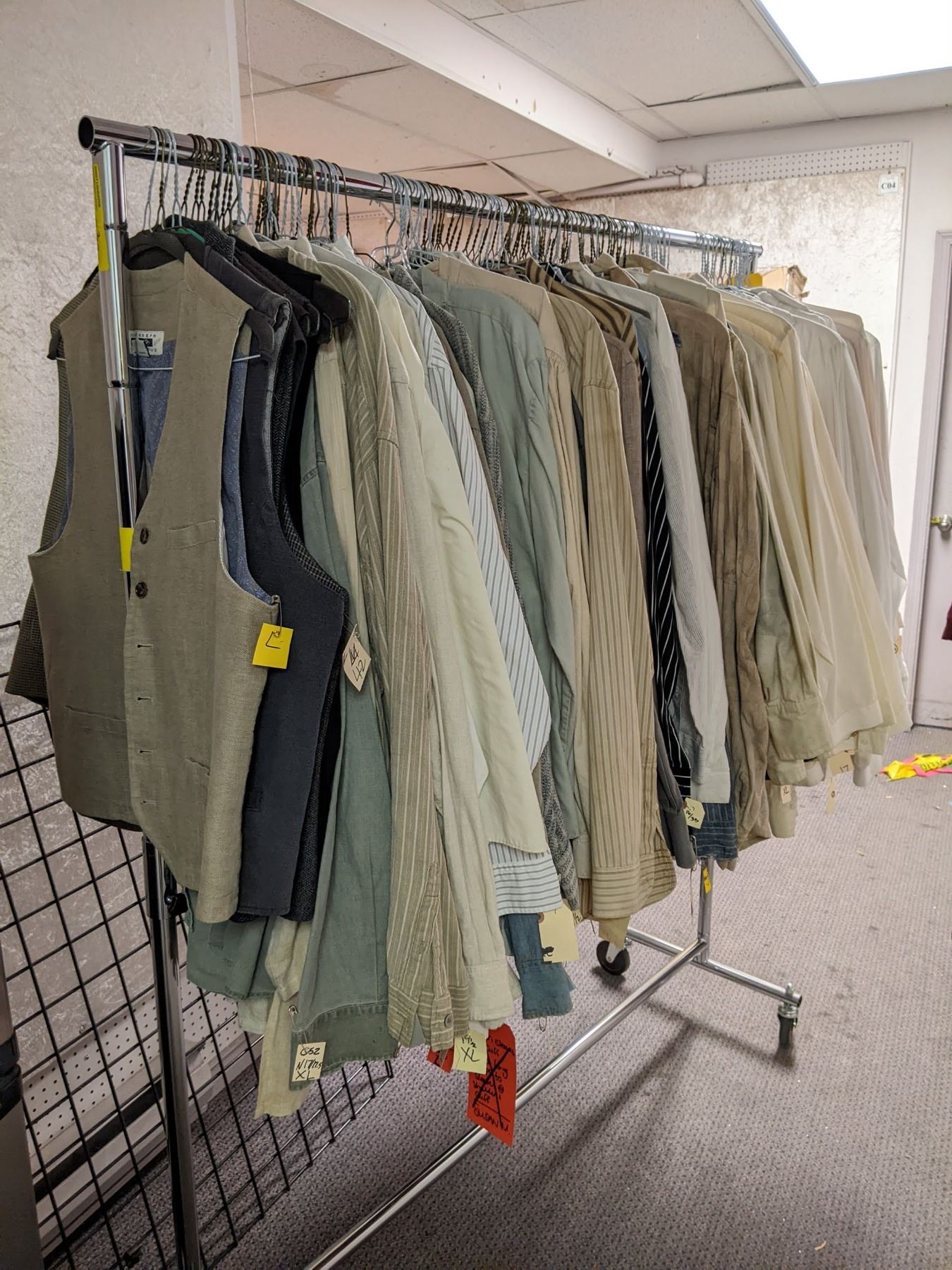 "Superhero Show" - Rack full of screen worn assorted shirts & vests ...