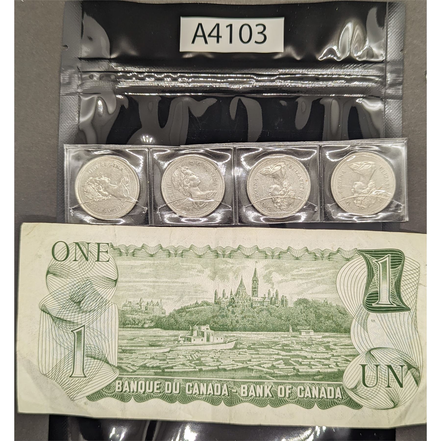 One Canada Dollar Bill Plus Four Mountie Quarters (A4103) (A4103)