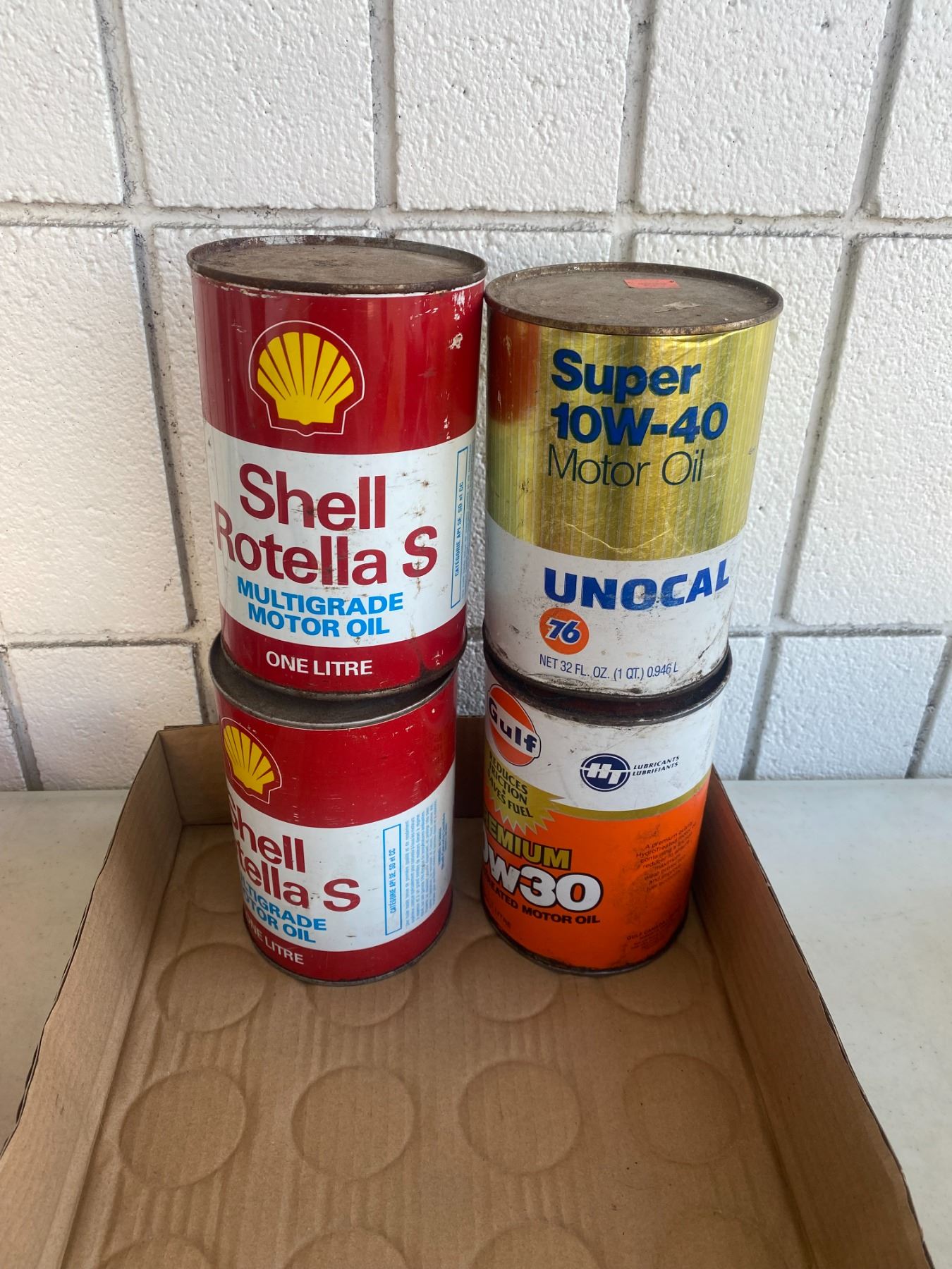 Gulf, shell, 76 vintage oil tins and contents