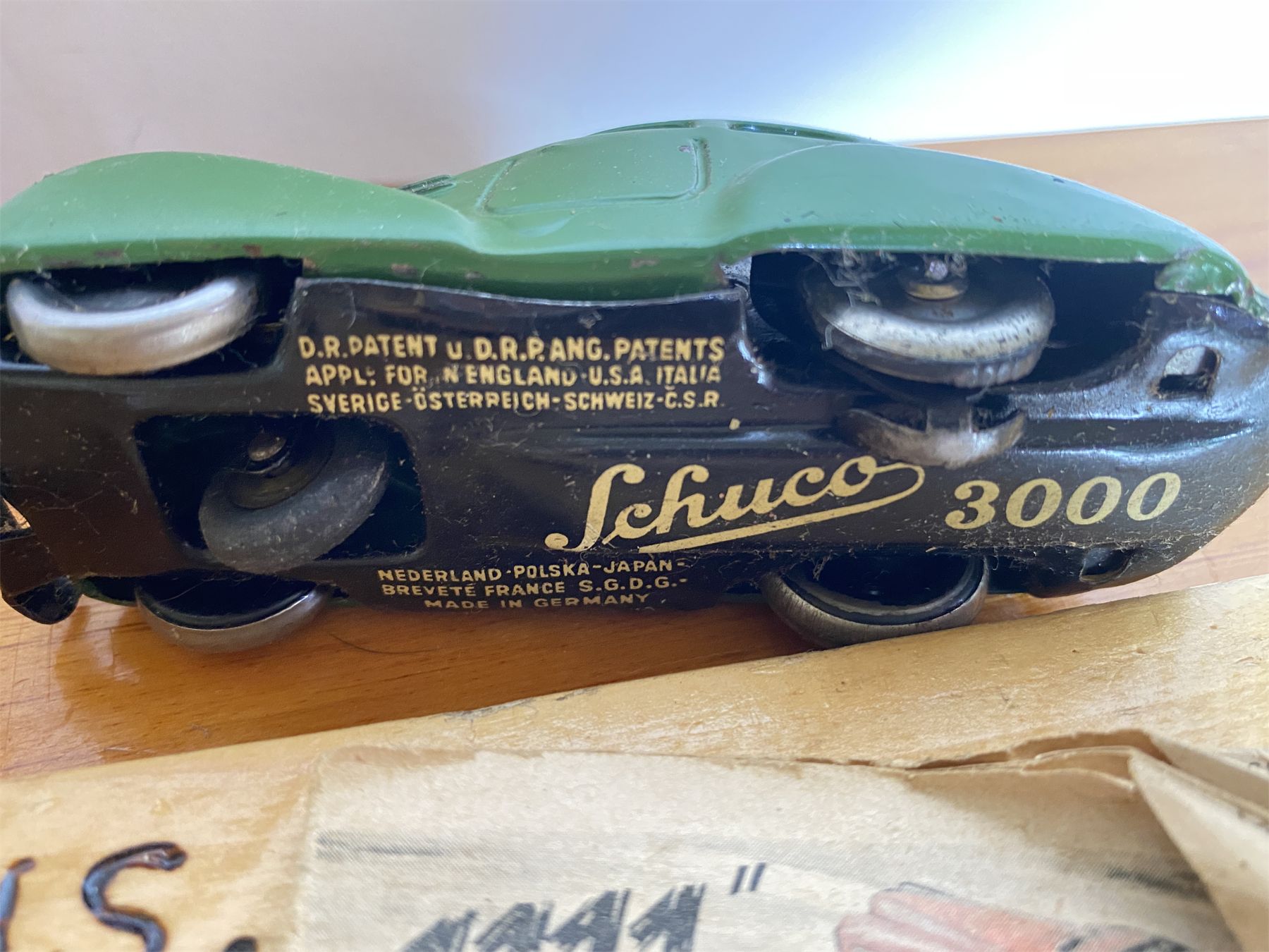 SCHUCO #3000 WIND-UP TIN CAR W/ INSTRUCTION BOOKLET