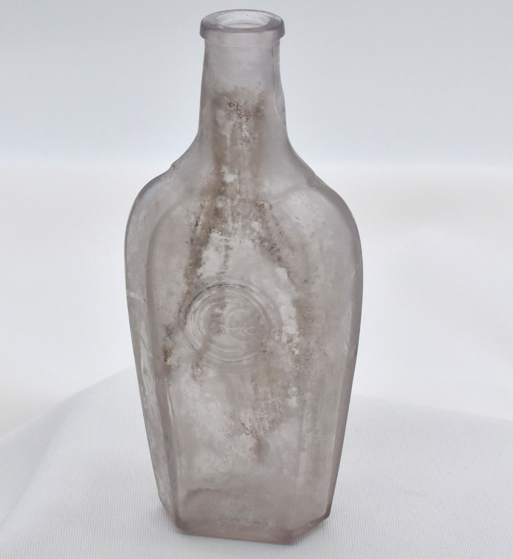 Antique Sun Purple Glass Coffin Bottle