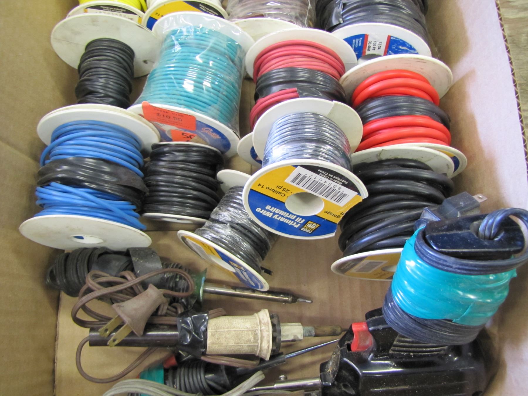 Box with soldering guns and electrical wire