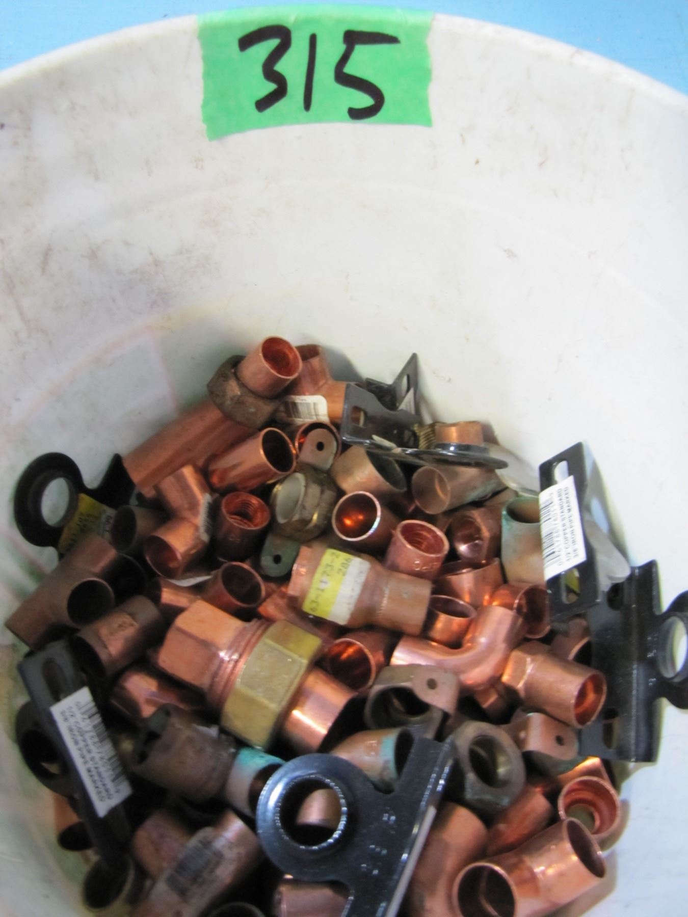Container of half inch copper fittings