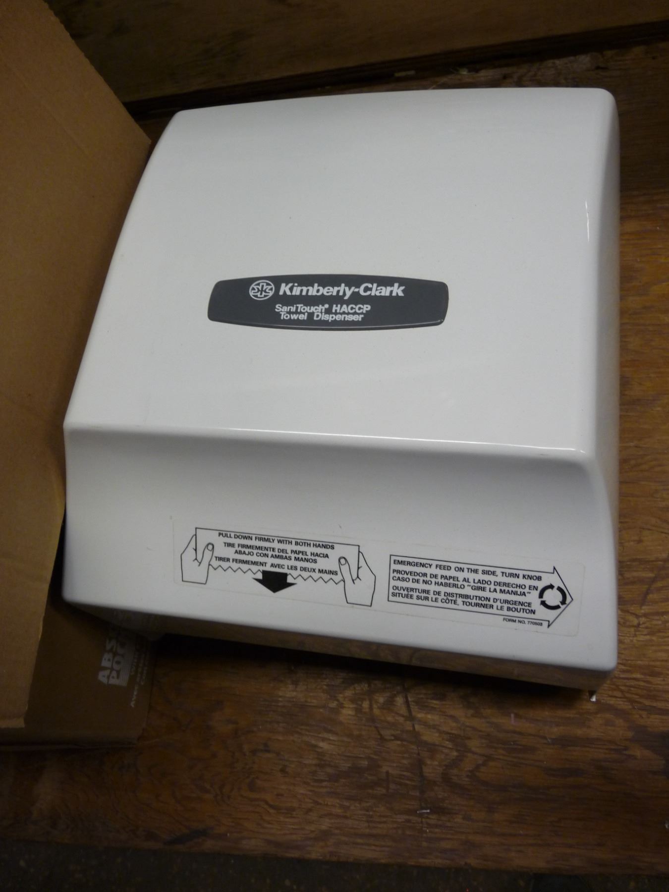 Kimberly-Clark paper towel dispenser and eight rolls of paper towel