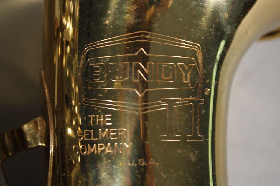 A Selmer Bundy II Brass and Chrome Alto Saxophone.
