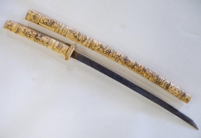 Carved ivory Samurai sword in scabre