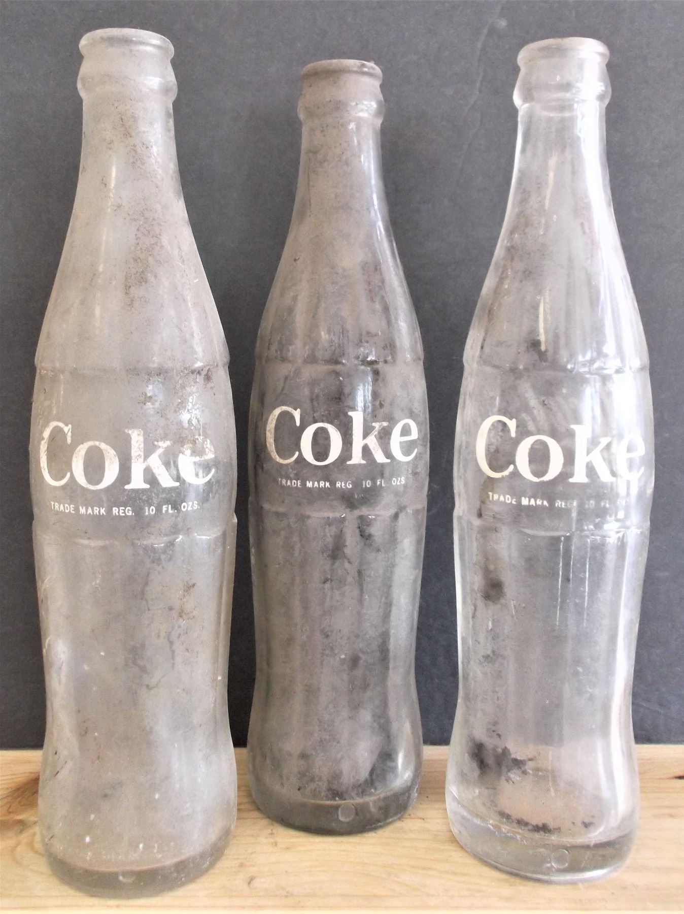 Three Vintage Coca-Cola Bottles