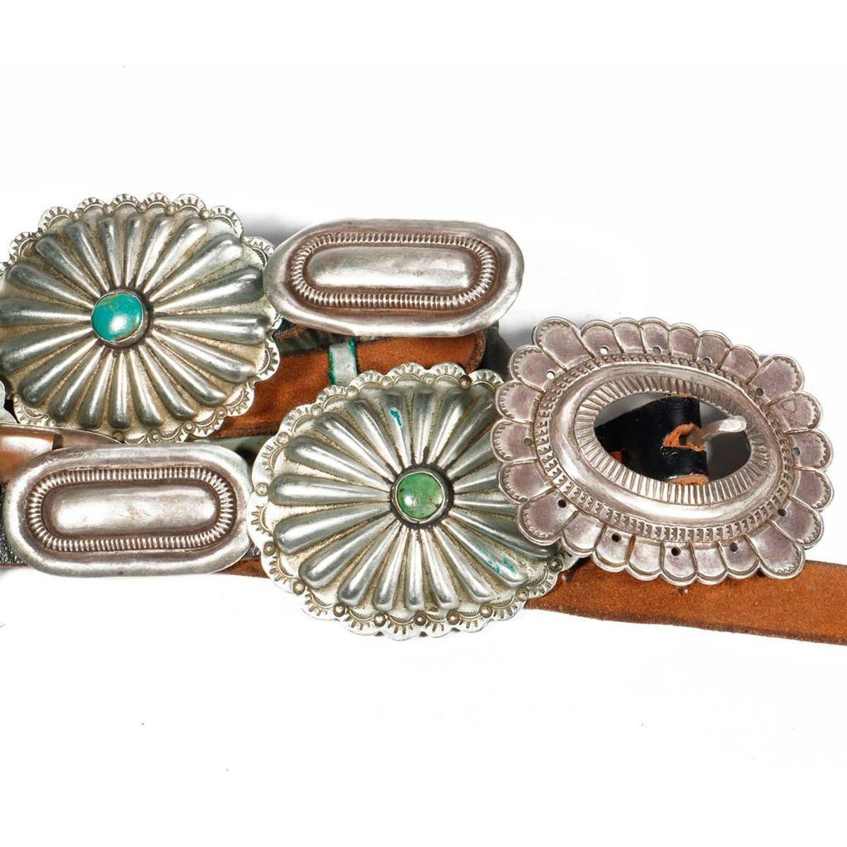 Group of Four Navajo Concho Belts. Group of Four Navajo Concho Belts.