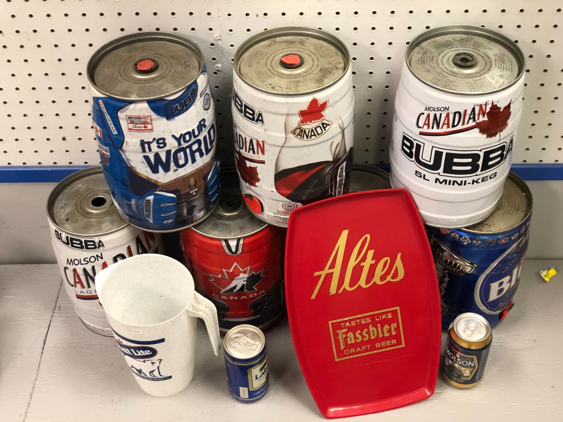 Group of collectible tin mini beers cans and beer related serving pieces
